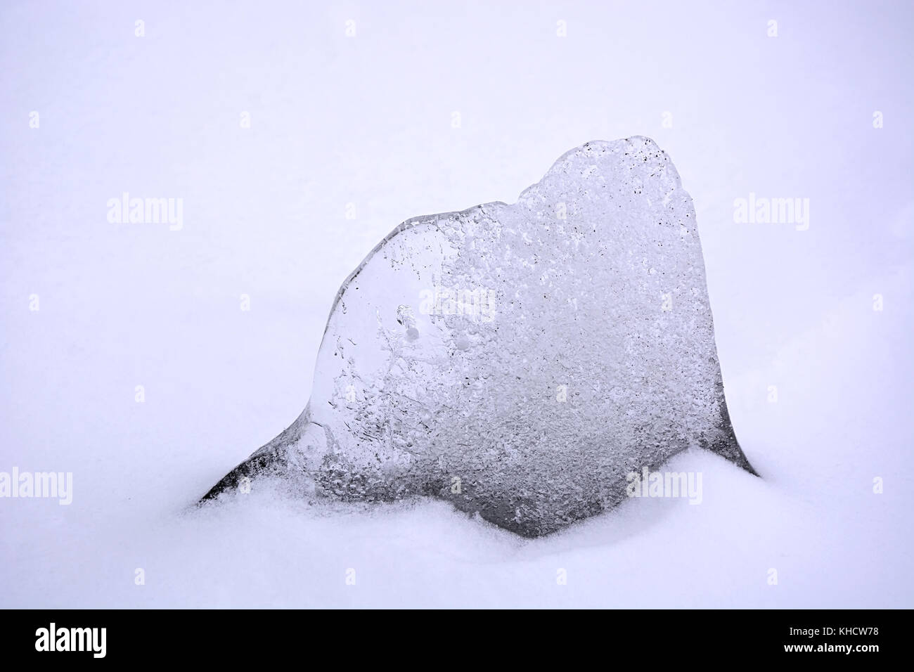 A piece of ice in the snow Stock Photo - Alamy