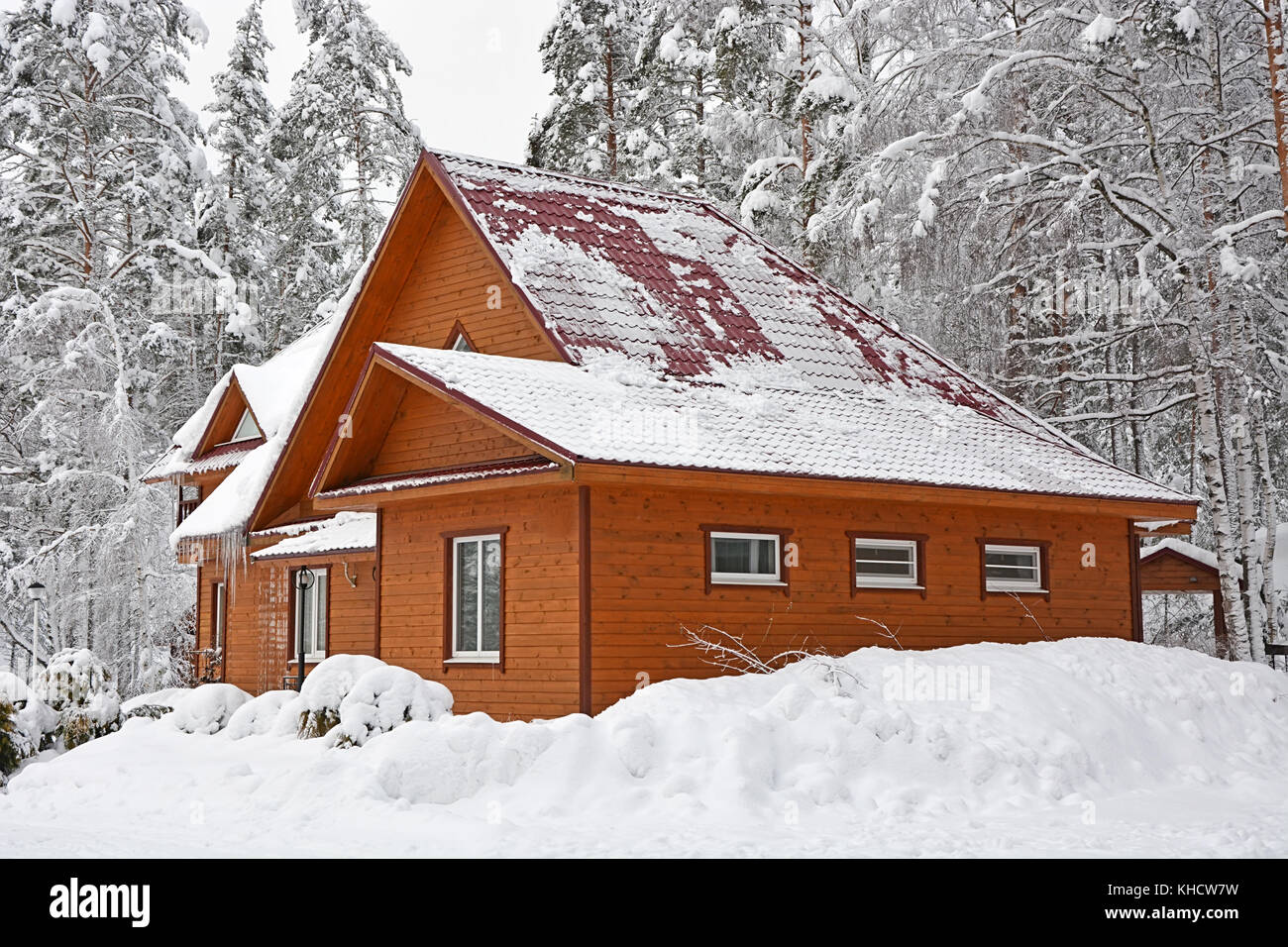 Big wooden house at the snowy winter forest Stock Photo - Alamy