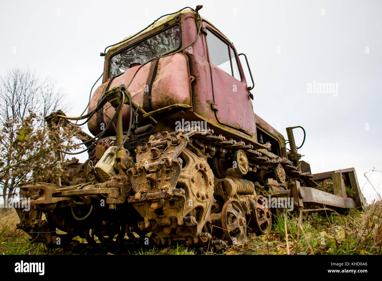 Old bulldozer standing alone in a field. Earthworks, old bulldozer on ...