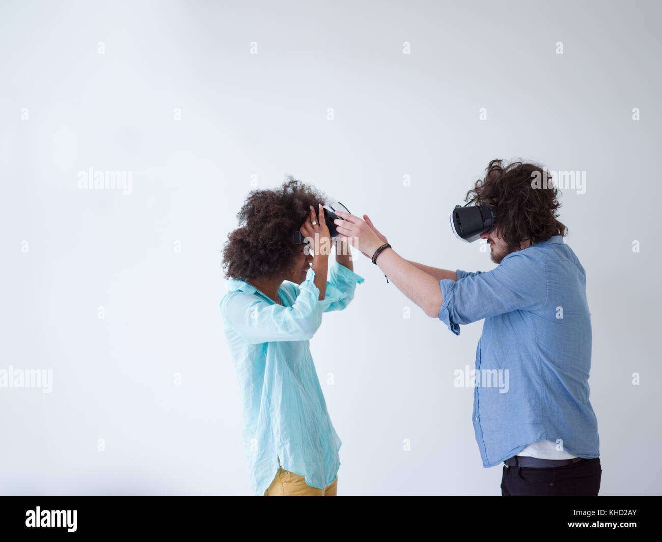 Happy multiethnic couple getting experience using VR headset glasses of ...