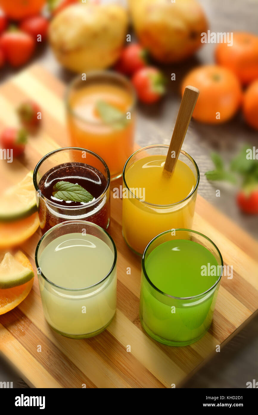 assorted fruit juices with ingredients around - closeup Stock Photo - Alamy