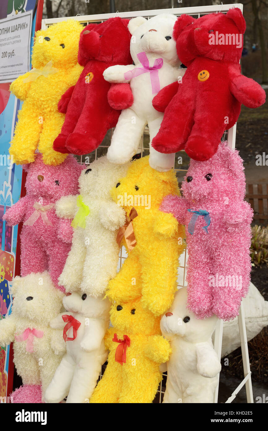 Colorful Teddy bears hanging in several rows Stock Photo - Alamy