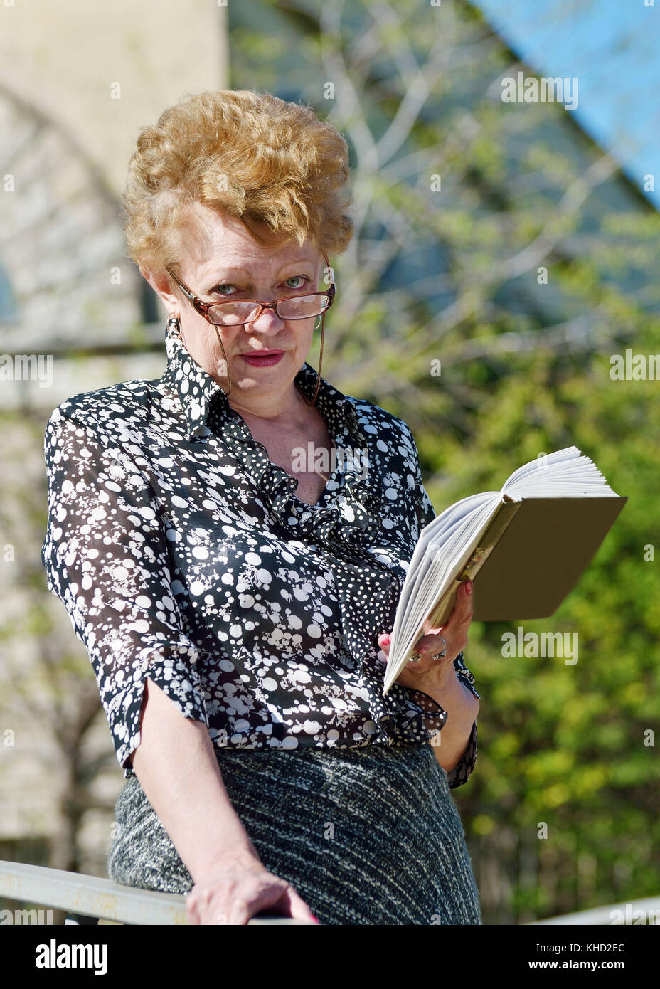 In the hands of women the book with a fascinating story Stock Photo - Alamy