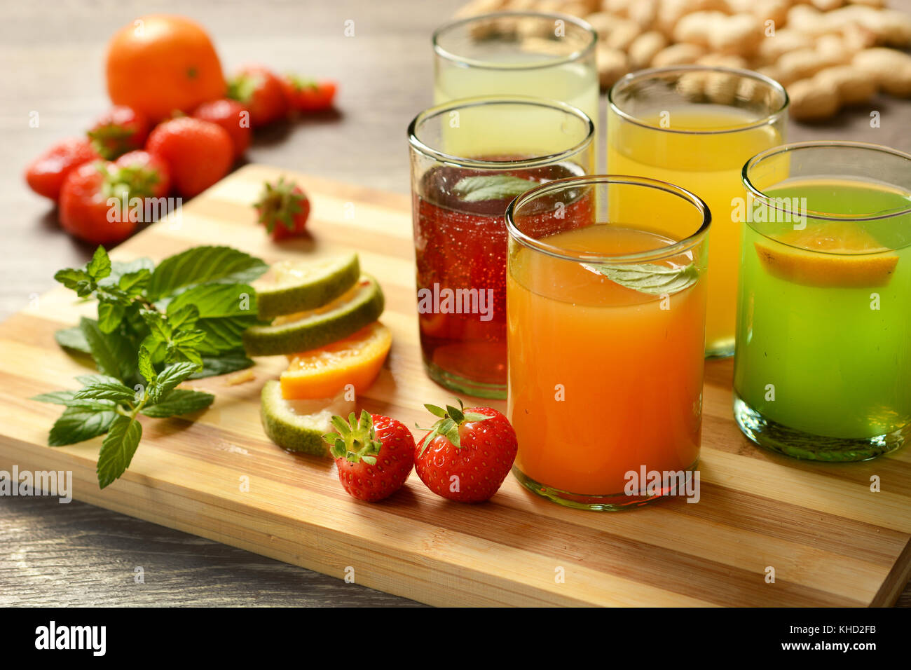 assorted fruit juices with ingredients around - closeup Stock Photo - Alamy