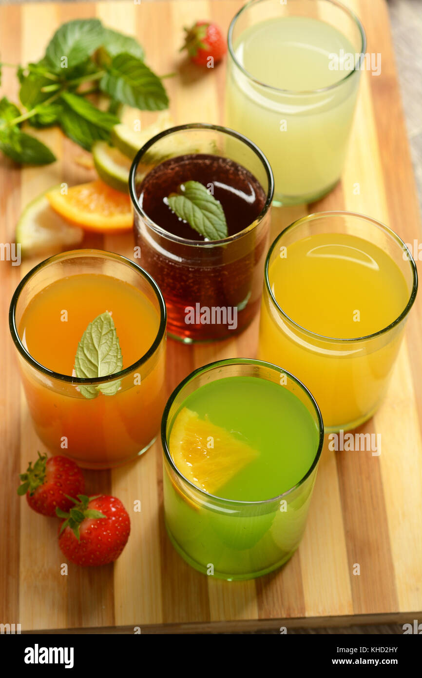 assorted fruit juices with ingredients around - closeup Stock Photo - Alamy