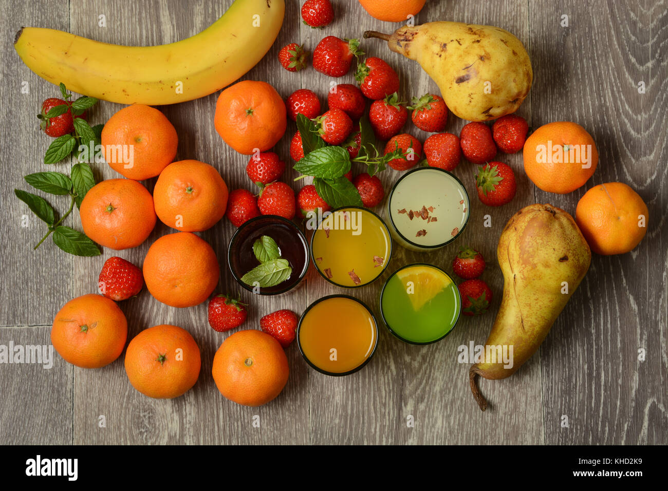 assorted fruit juices with ingredients around - closeup Stock Photo - Alamy