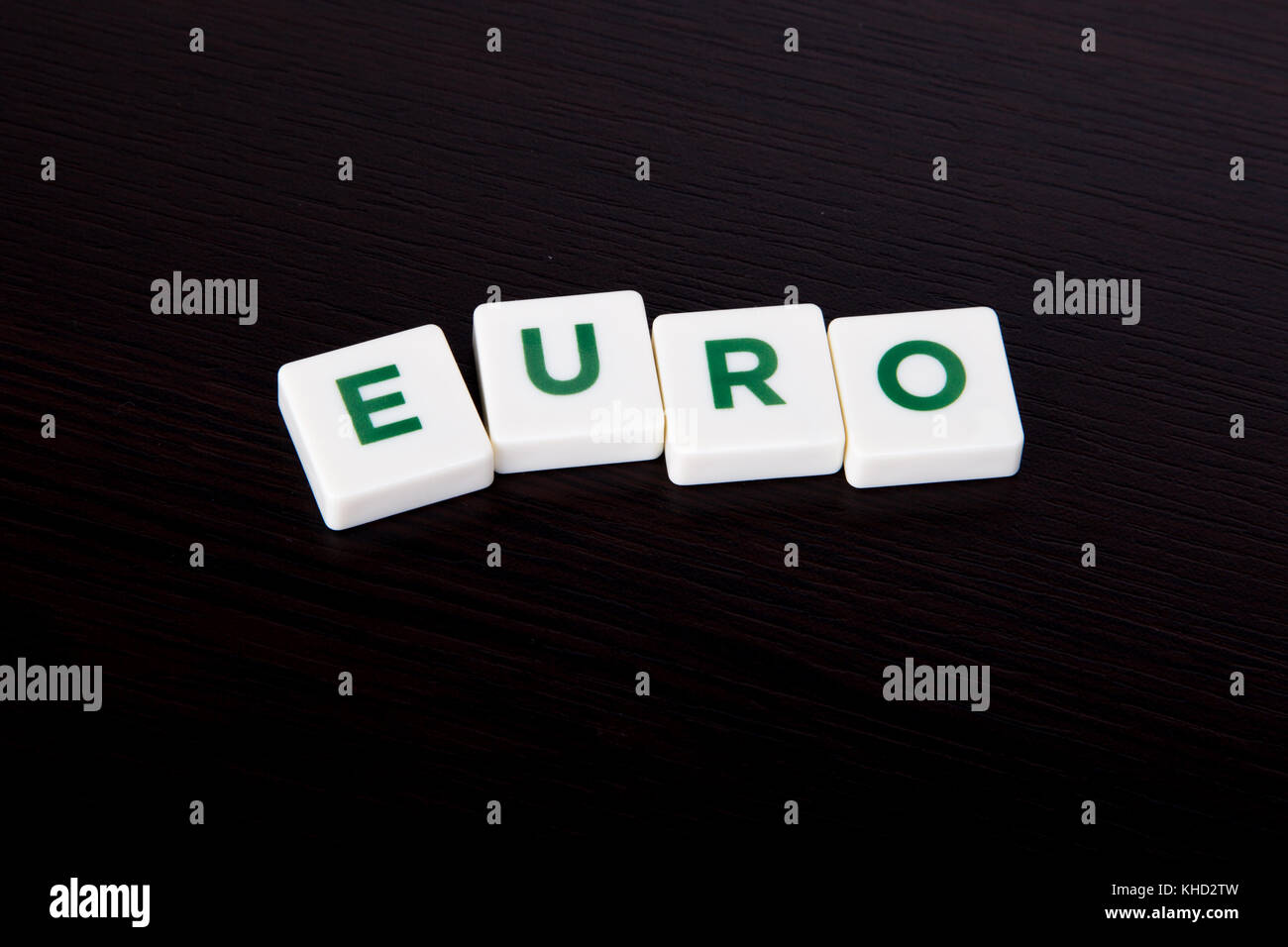 Euro with letters and on wooden background Stock Photo - Alamy
