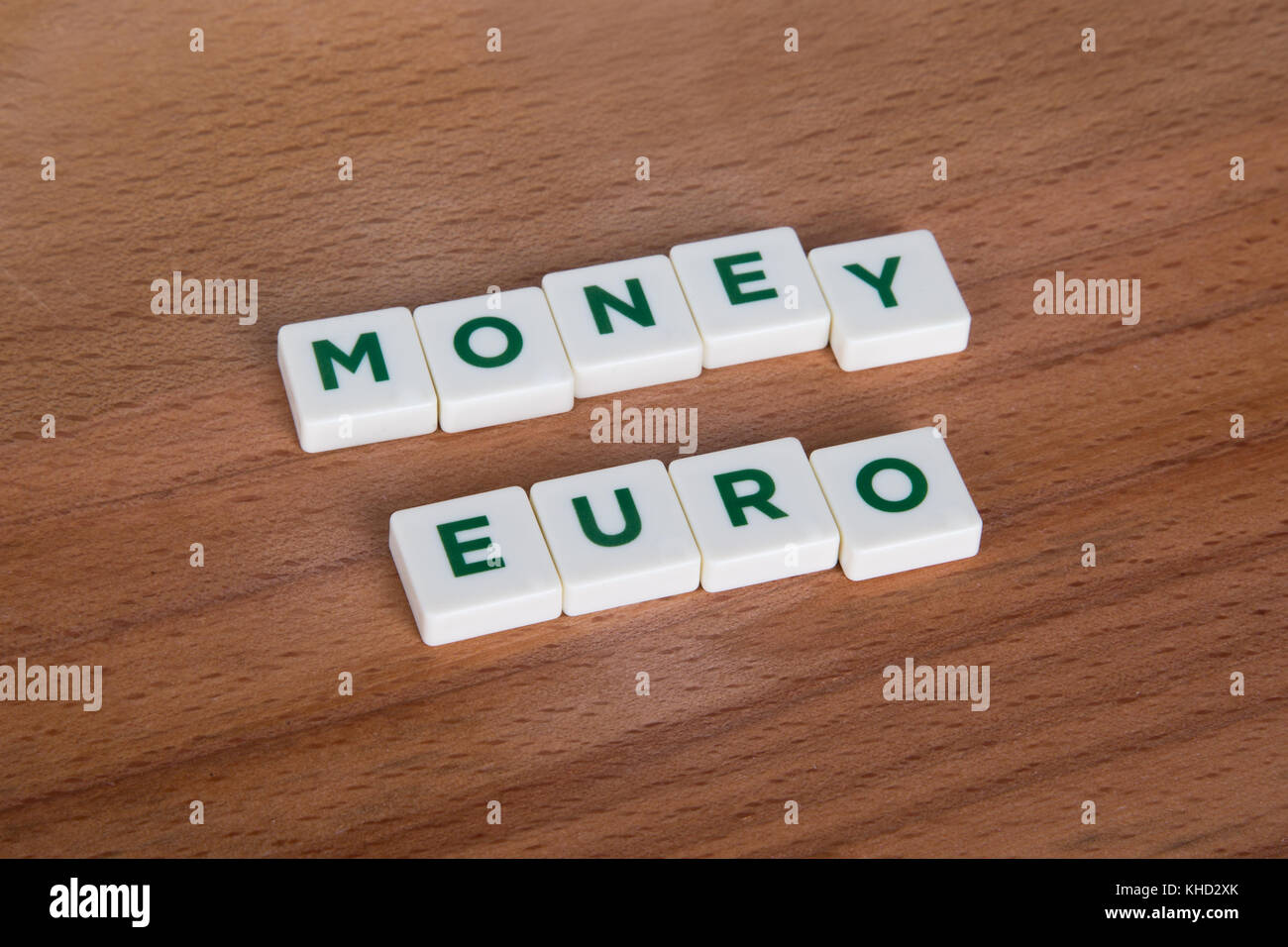 Money euro word with letters and on wooden background Stock Photo - Alamy