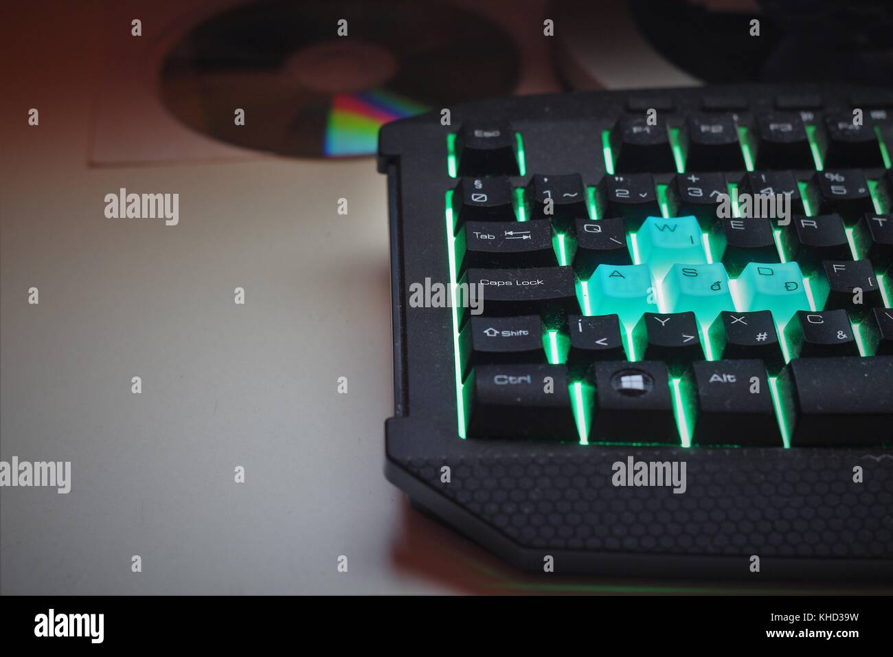 gamer keyboard and dvd disc Stock Photo - Alamy