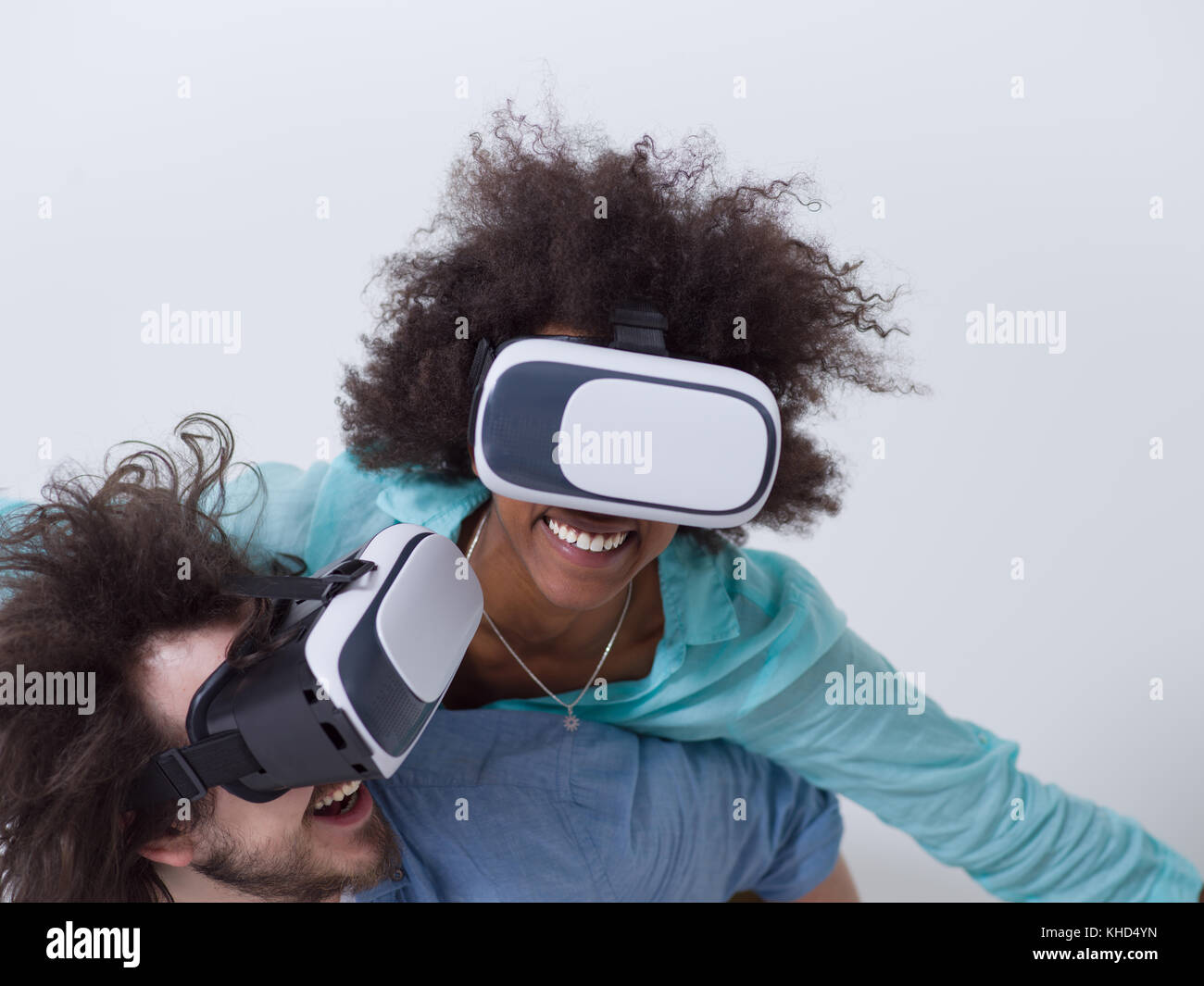 Happy multiethnic couple getting experience using VR headset glasses of ...