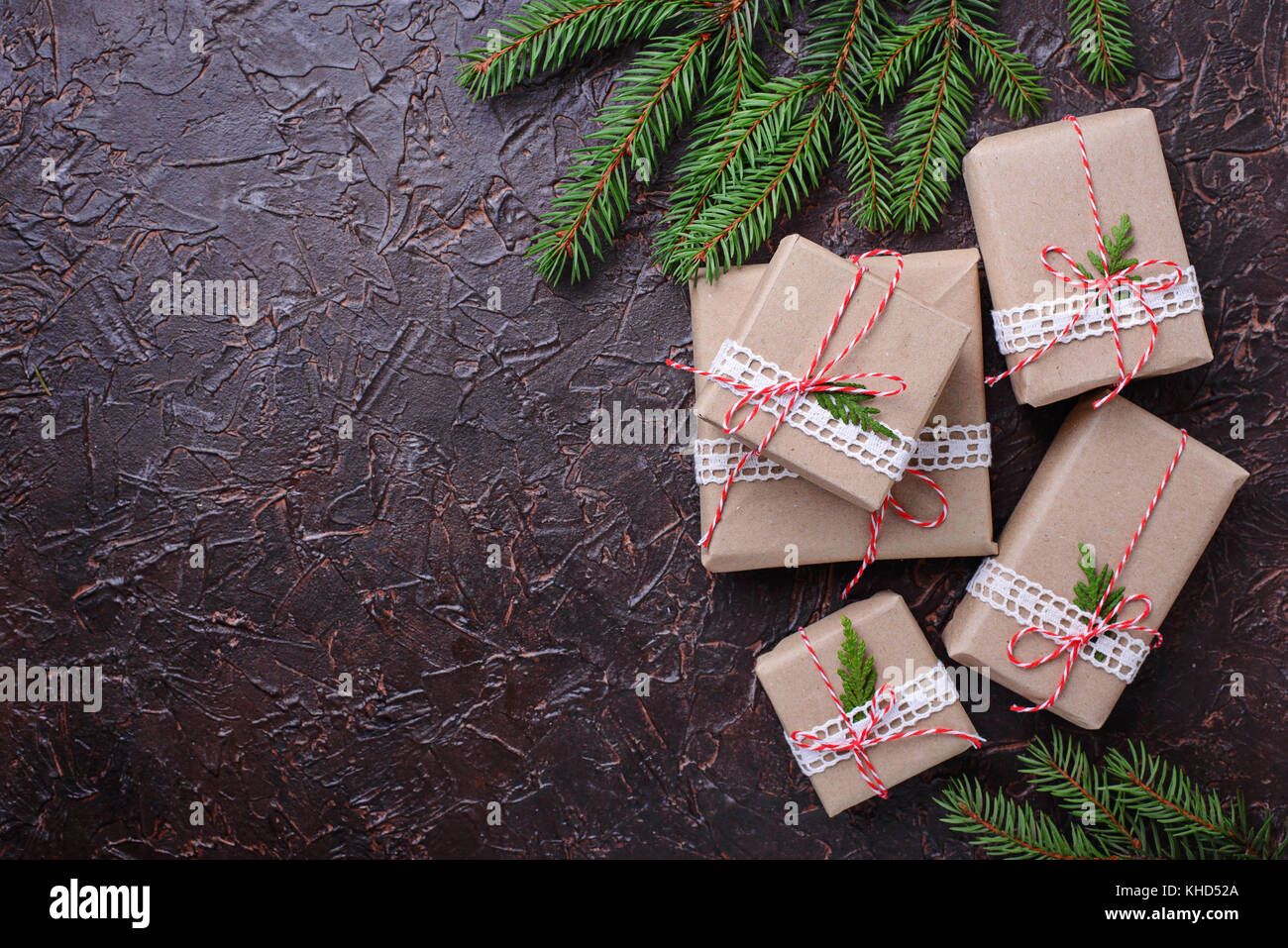 Christmas gift boxes in craft paper Stock Photo - Alamy
