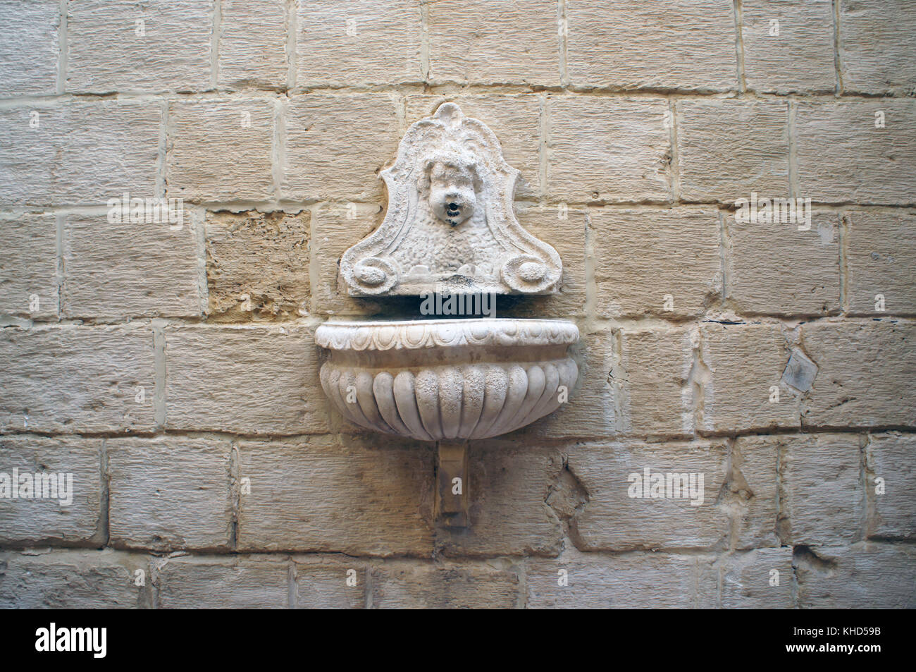 Baroque wall fountain with boy's face in old part of Bormla - Three ...