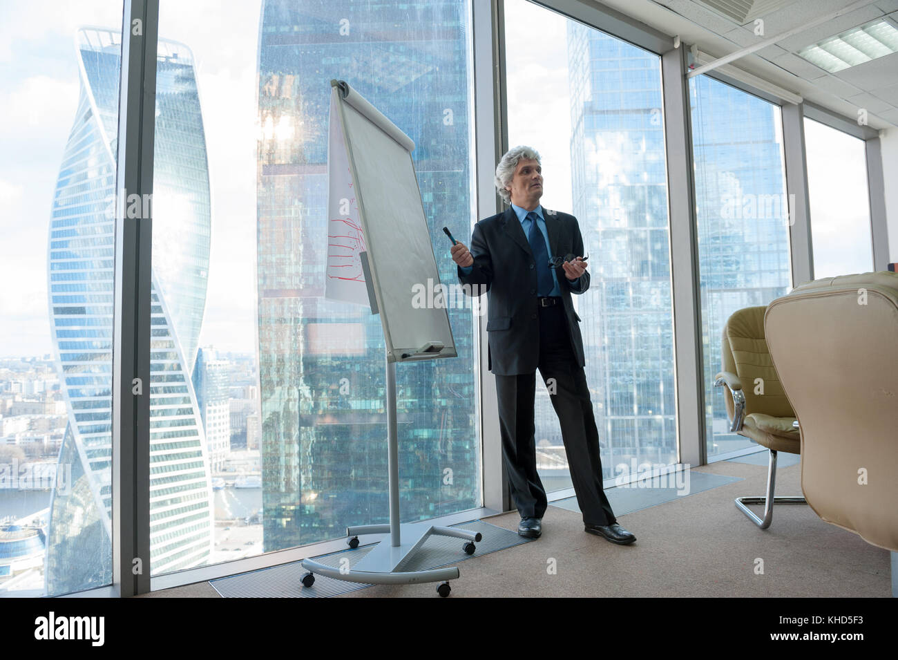 Mature business man making a presentation Stock Photo - Alamy