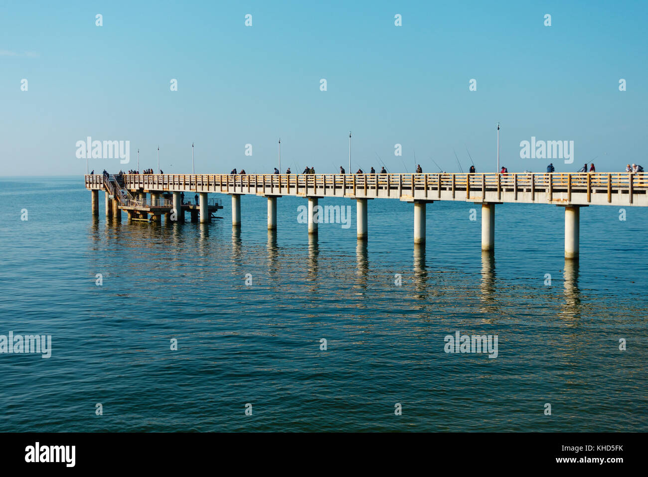 Fisherman fishing from pier hi-res stock photography and images - Alamy