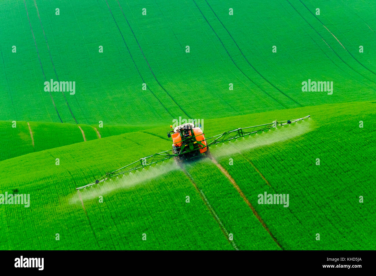 Tractor spraying the chemicals Stock Photo - Alamy