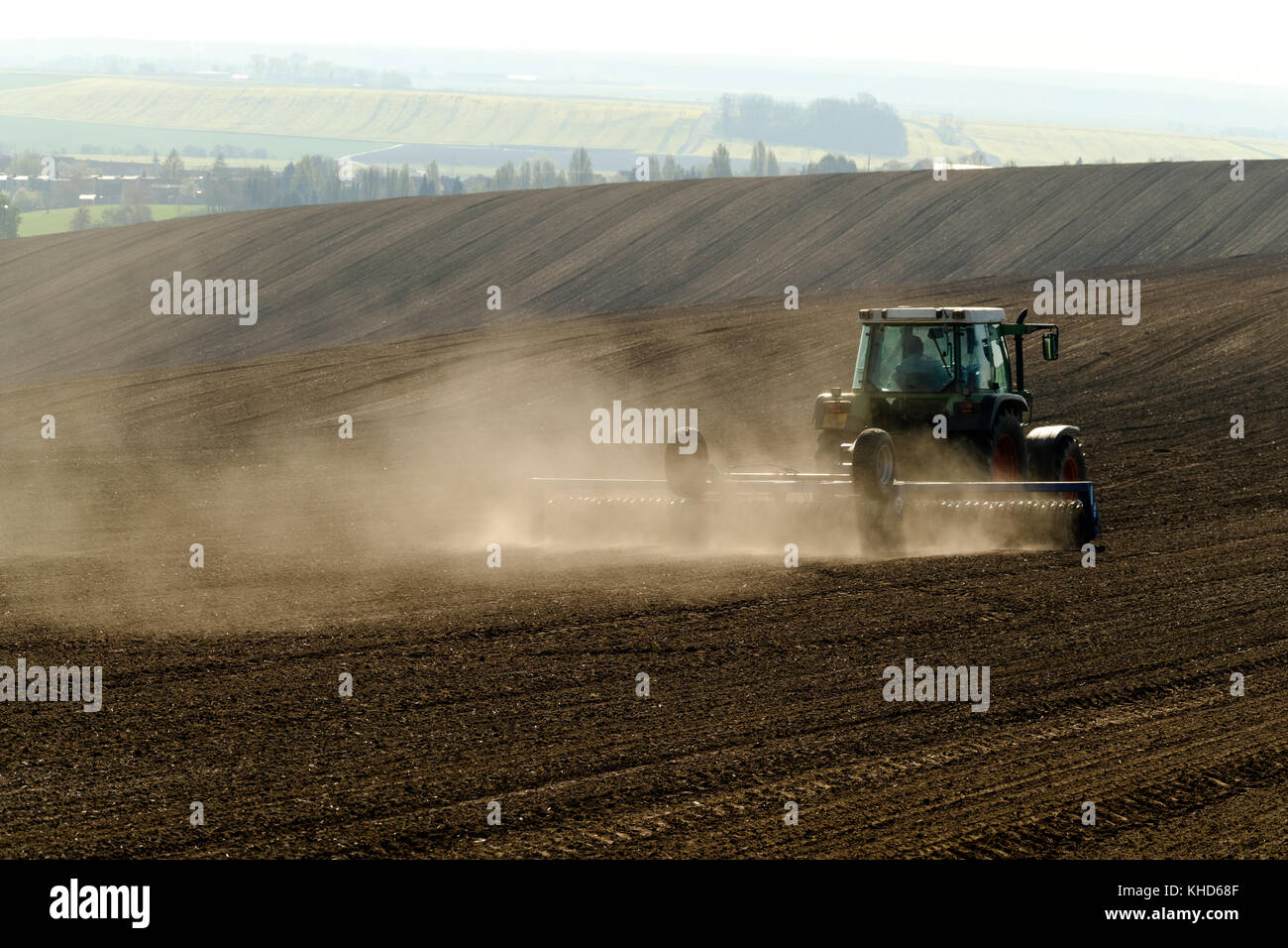 Agricultural tractor working Stock Photo - Alamy