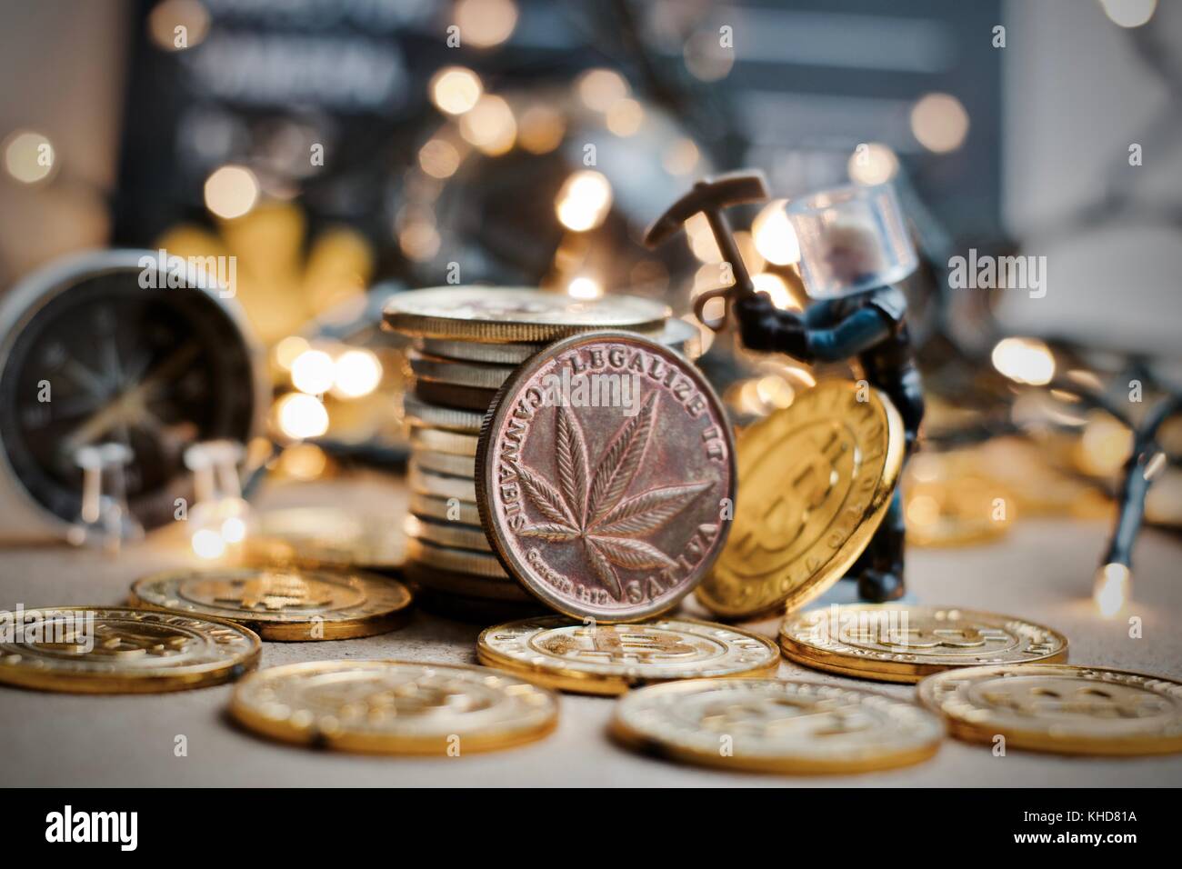 Physical brass marijuana coin with cannabis leaf on the front ...