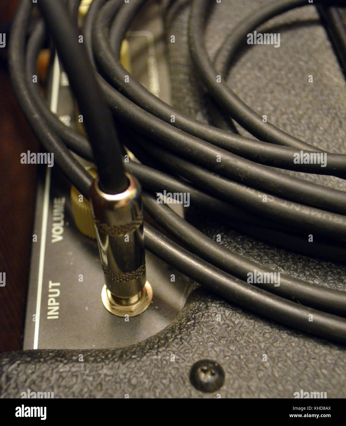 An instrument cable plugged in to an amplifier Stock Photo - Alamy