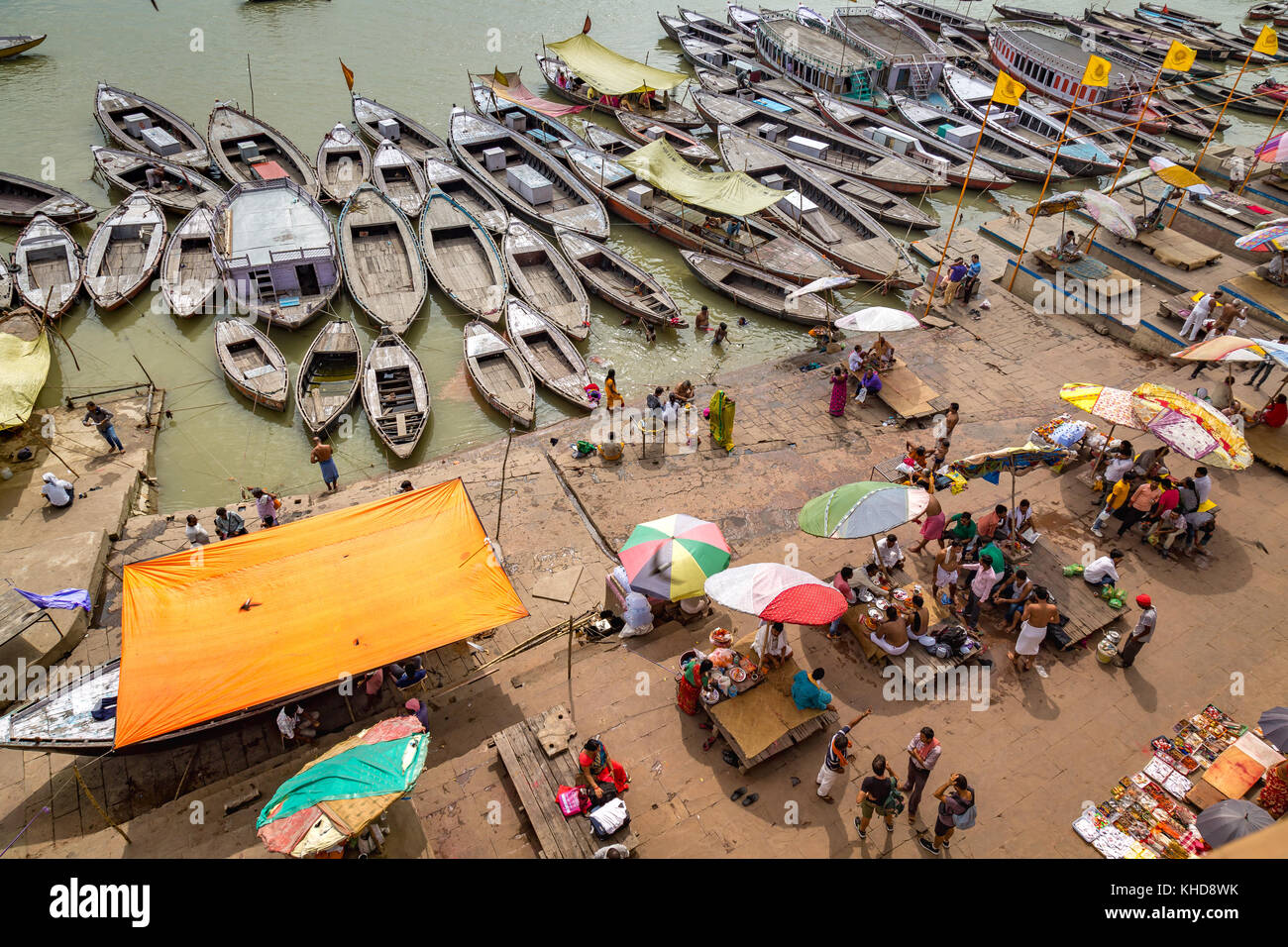 Varanasi ghat aerial view of multicolored wooden boats lined up at the ...