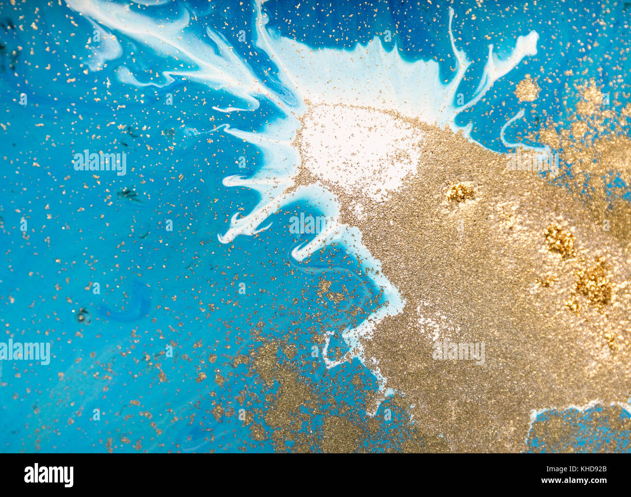 Marbled blue abstract background with golden sequins. Liquid marble ink ...