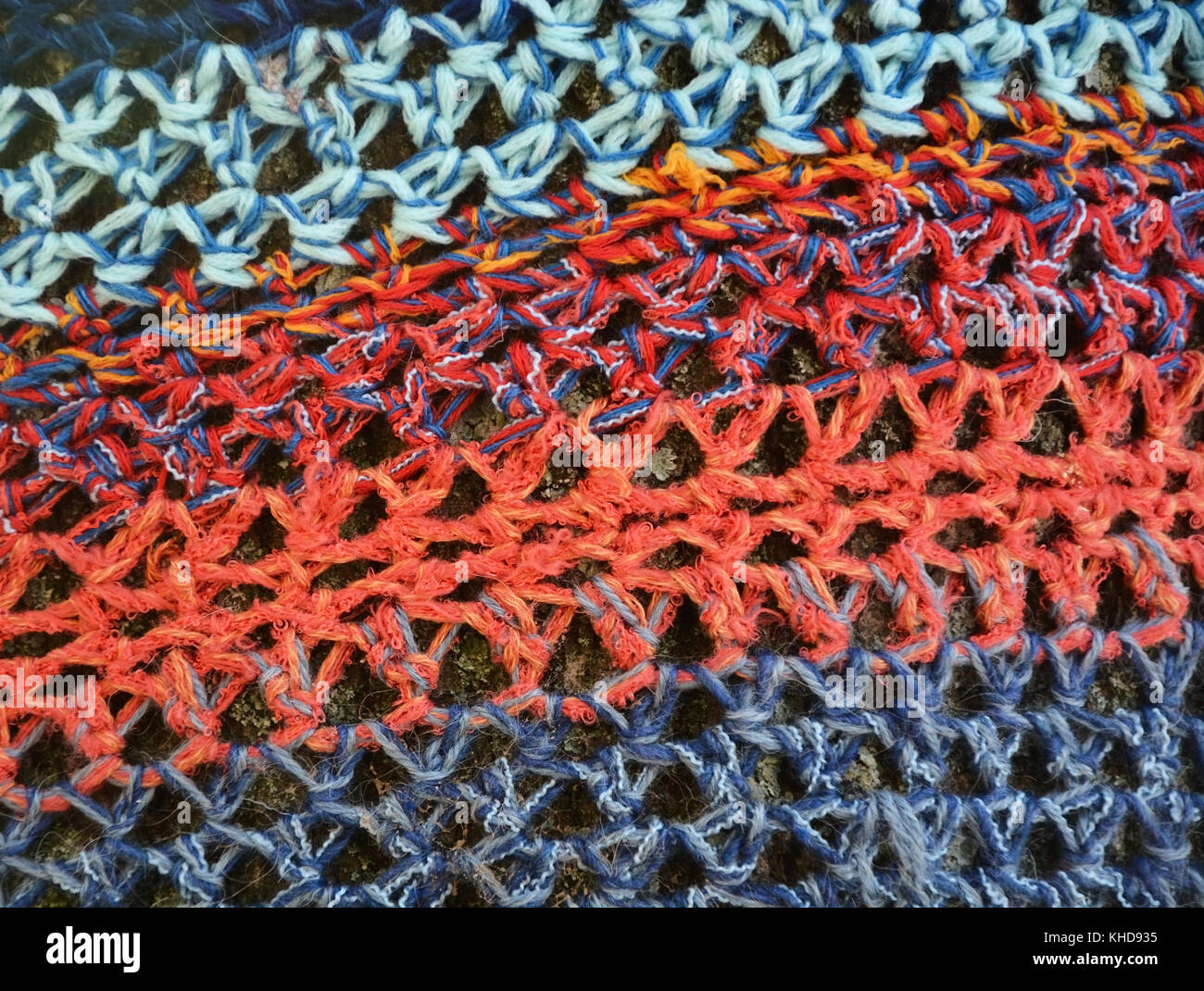 Knitted background with different colors on tree bark Stock Photo - Alamy