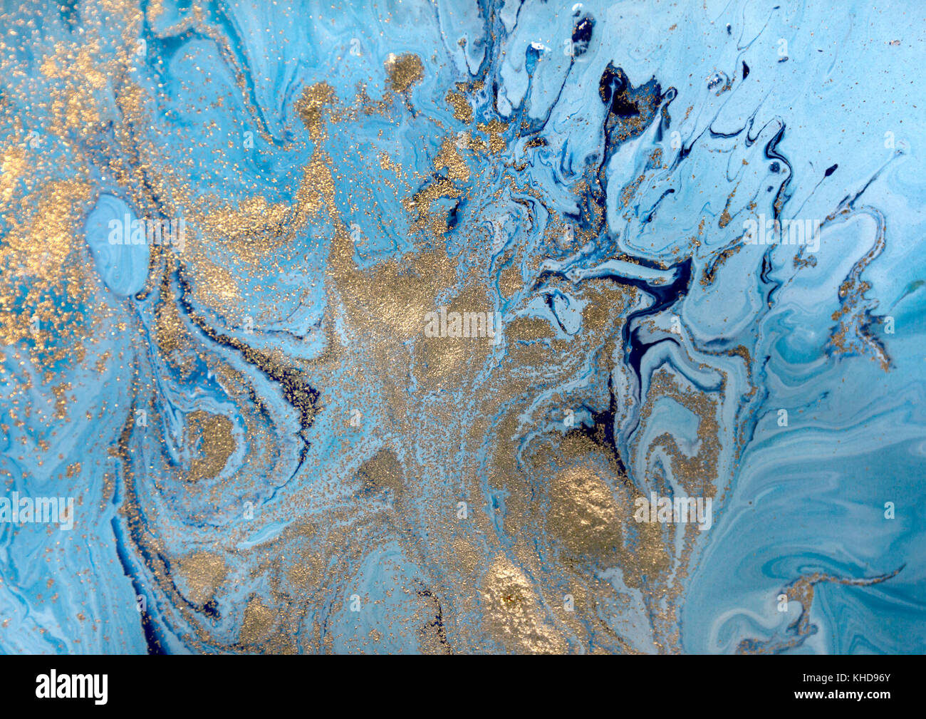Marbled blue abstract background with golden sequins. Liquid marble ink ...
