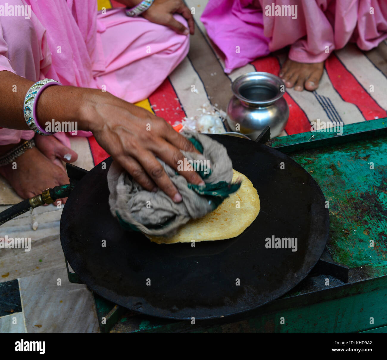 Indian woman cooking traditional bread hi-res stock photography and ...