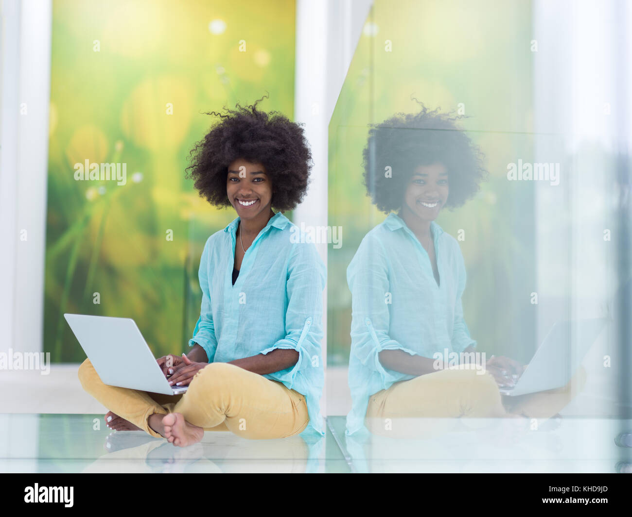 beautiful young african american women using laptop computer on the ...