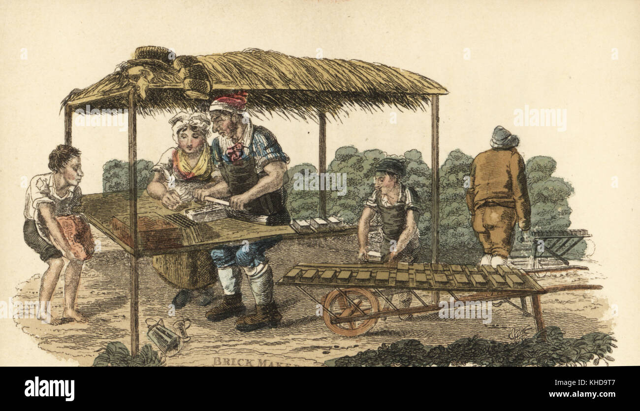 Family of brickmakers in a shed shaping clay in molds, boy bringing ...