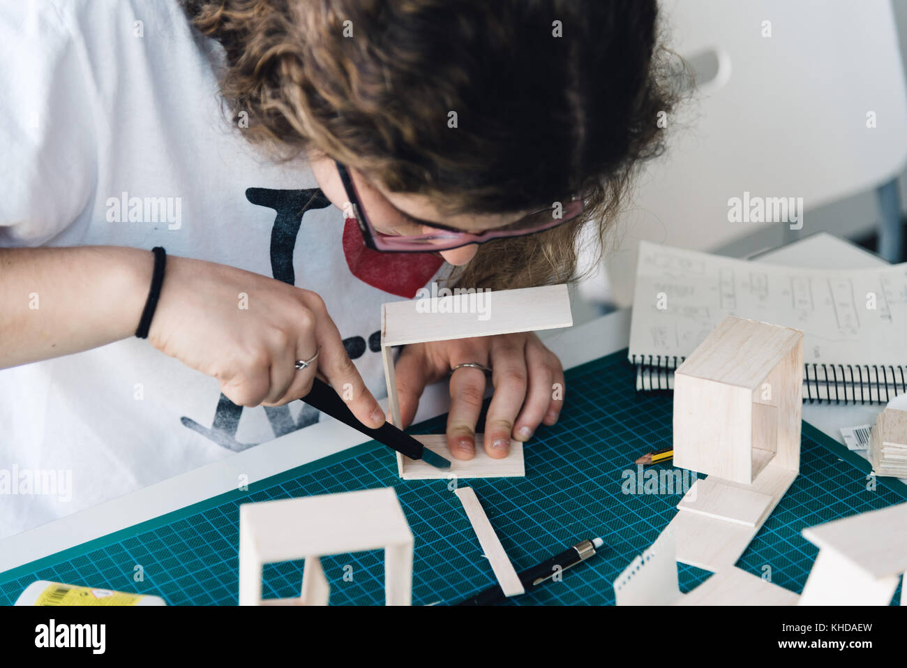 Woman architecture student working on models Stock Photo - Alamy