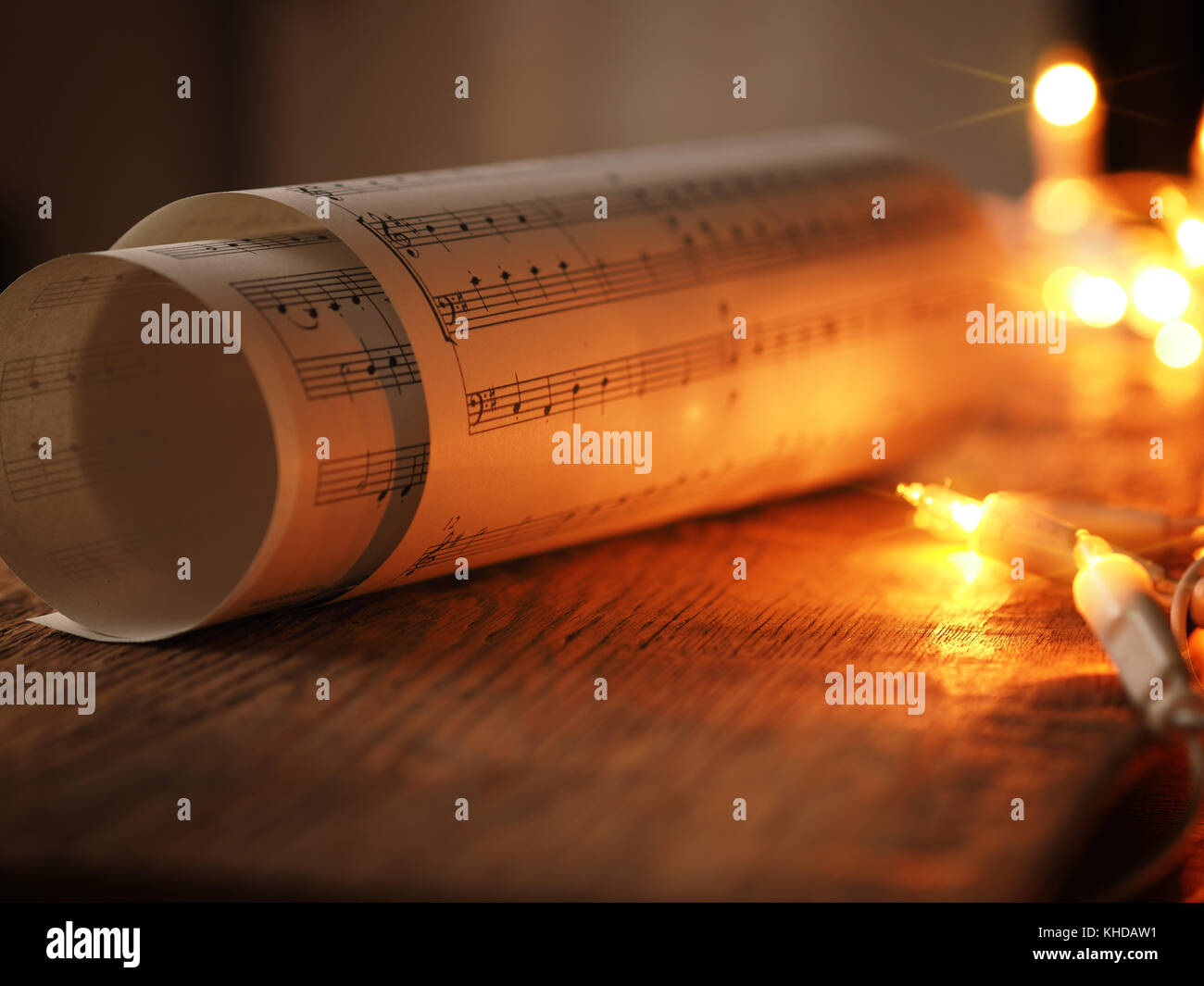 christmas-sheet-music-on-an-old-wooden-table-with-christmas-lights
