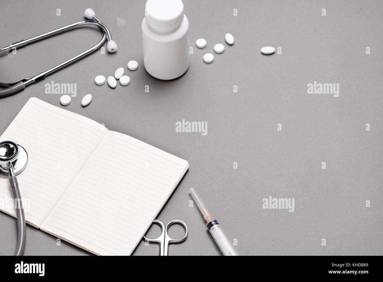 Top view of doctor desk table with stethoscope and medical items. Flat ...