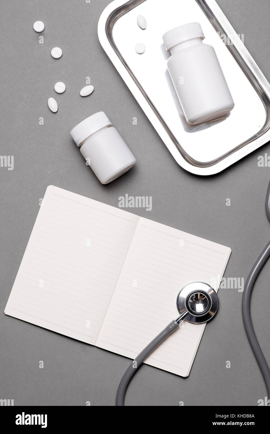 Top view of doctor desk table with stethoscope and medical items. Flat ...