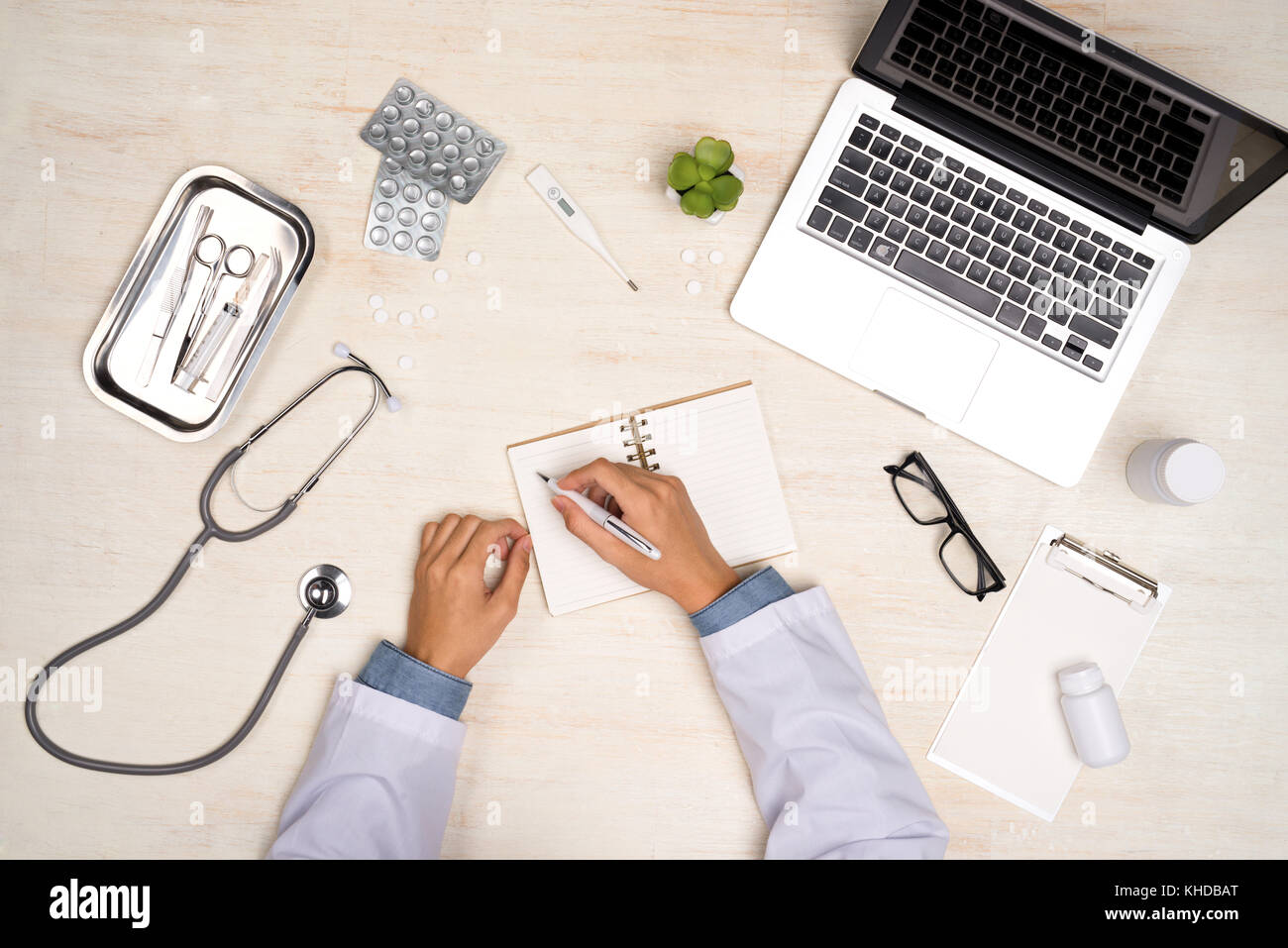 Top view of Medicine doctor hand working on the desk Stock Photo - Alamy