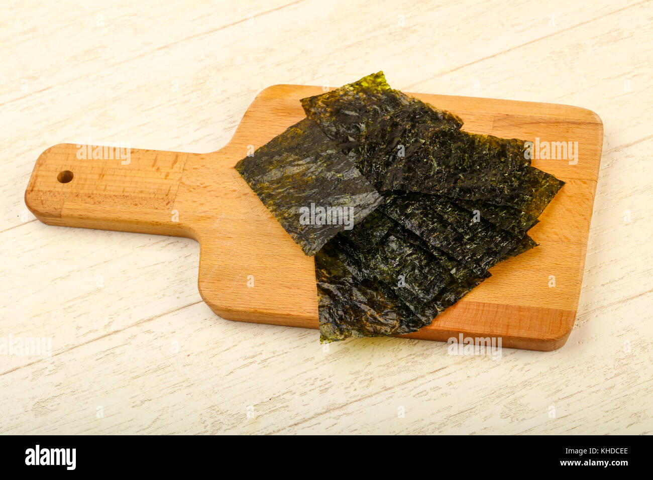 Crispy Nori sheets chips over wooden background Stock Photo - Alamy