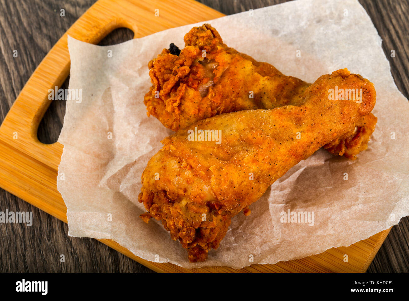 Crispy chicken legs with ketchup Stock Photo - Alamy