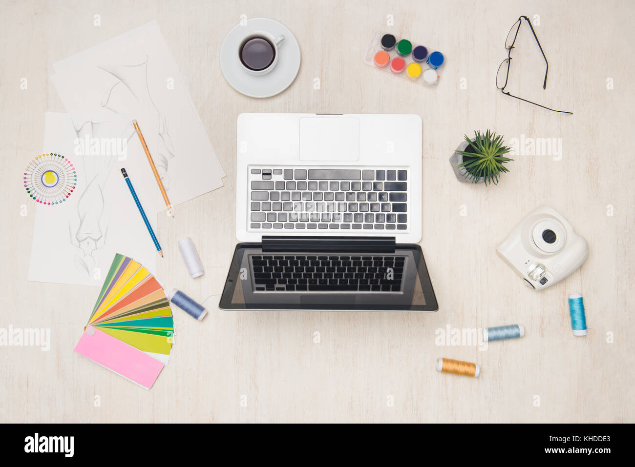 Graphic designer desk essentials top view with wooden texture ...
