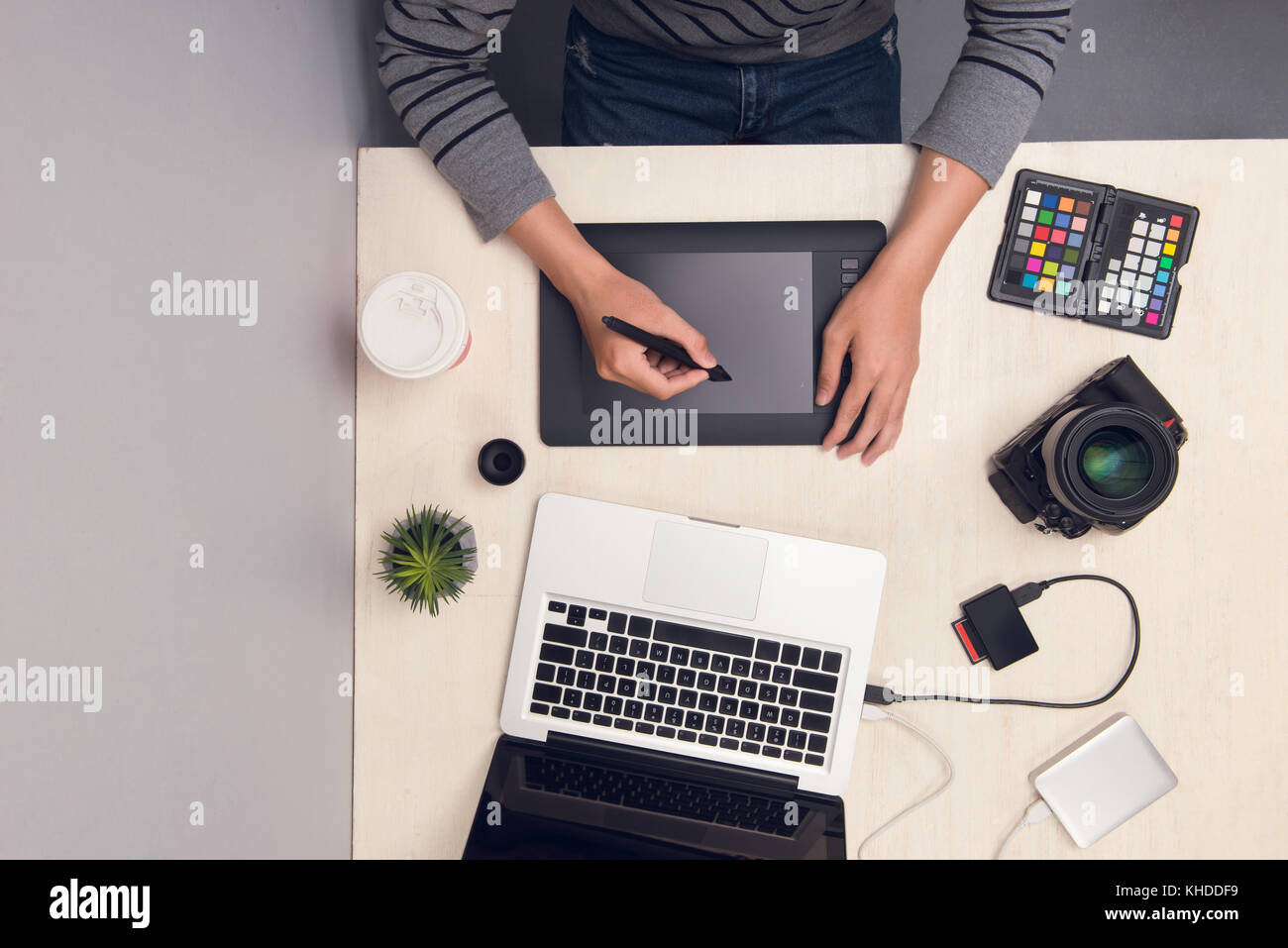 Graphic designer working with digital tablet at desk. Top view Stock ...