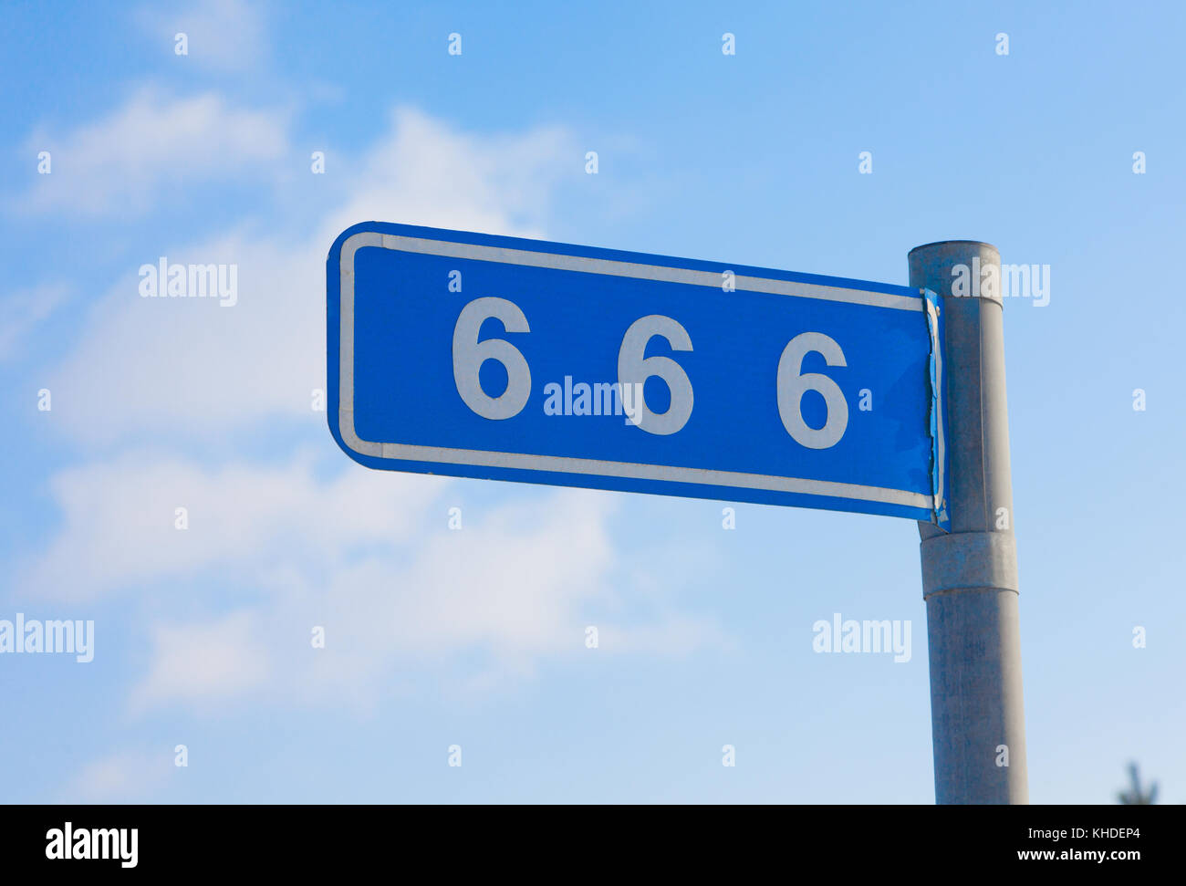 666 mile mark on a blue background Stock Photo - Alamy