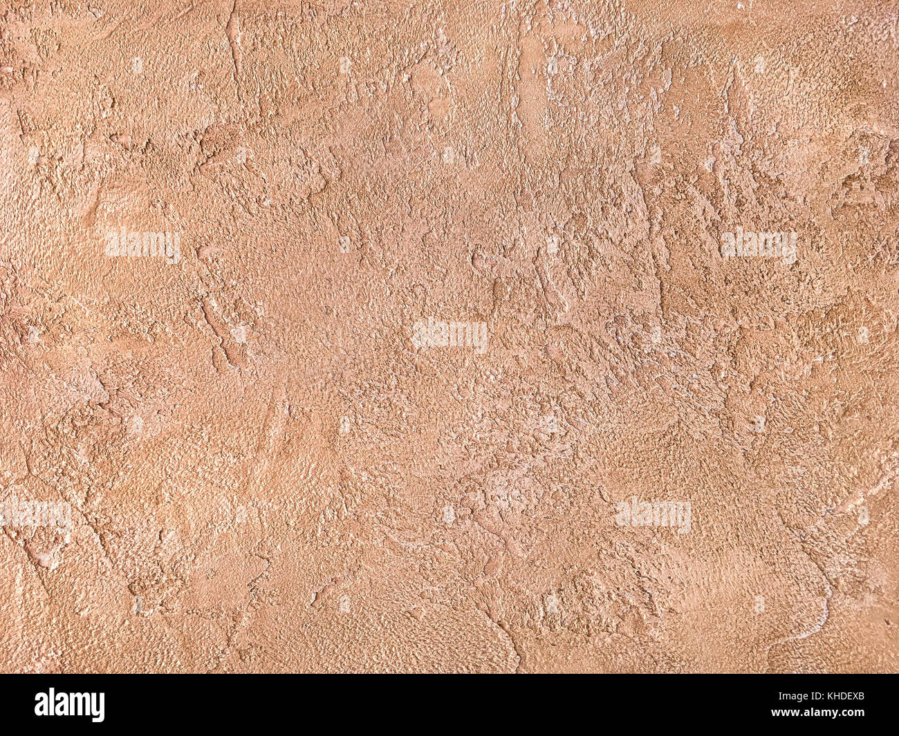 Old light brown wall covered with shabby uneven plaster. Texture of ...