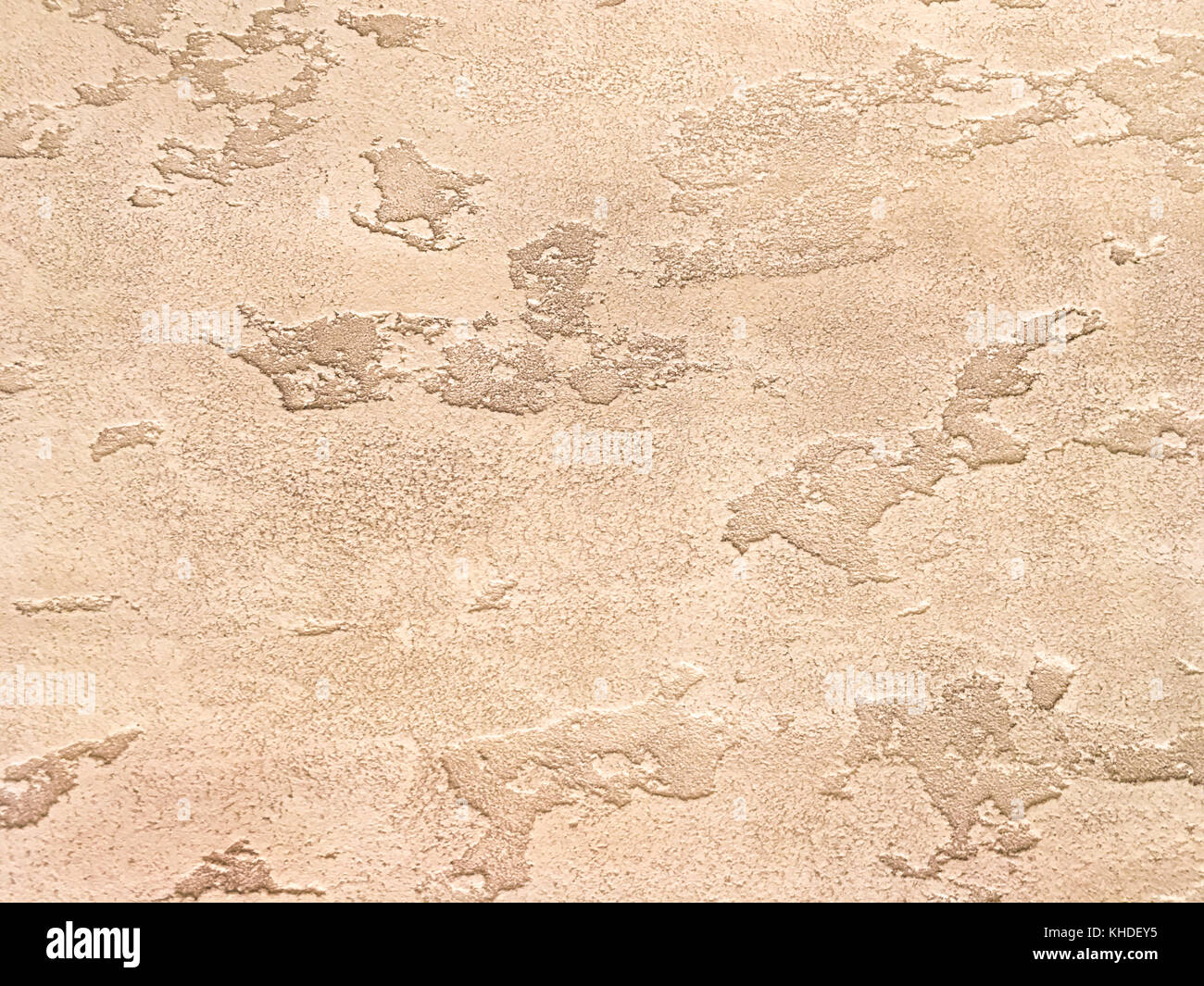 Old light brown wall covered with shabby peeling plaster. Texture of ...