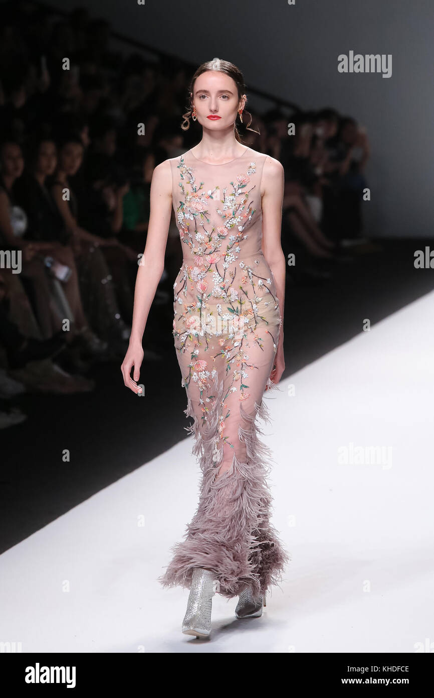 A model on the catwalk at the Wang Feng show during Shanghai Fashion ...