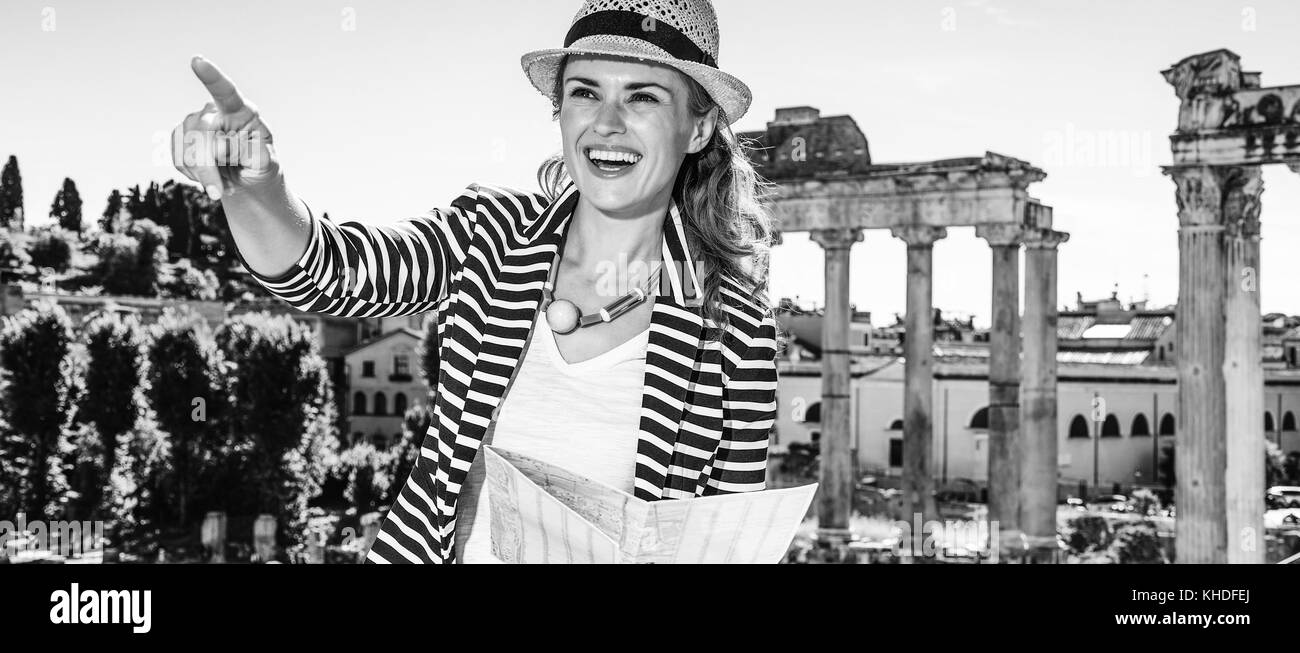 Roman Holiday. smiling modern woman in Rome, Italy holding map and ...