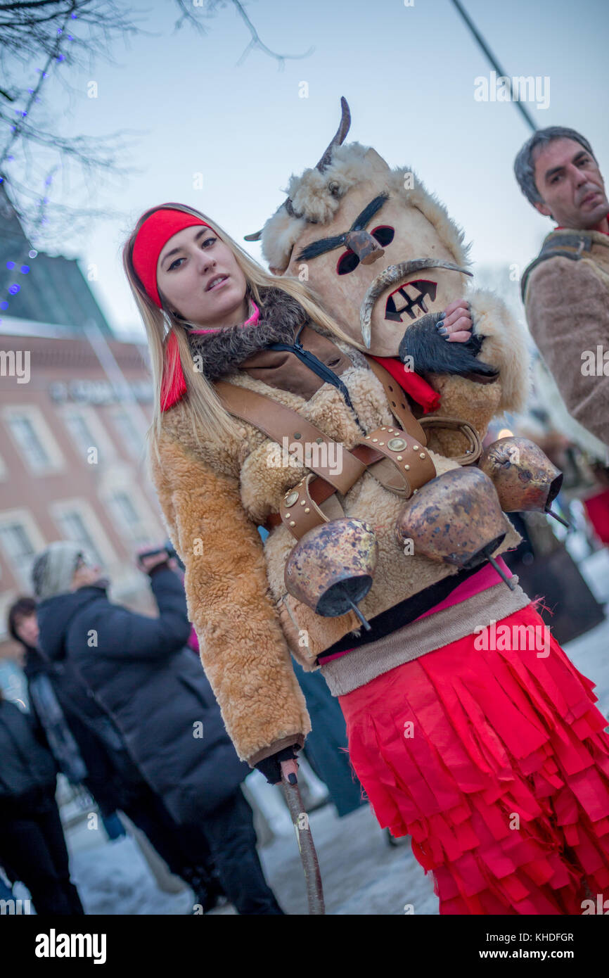 PERNIK, BULGARIA - JANUARY 27, 2017: Beautiful kuker girl carrying big ...