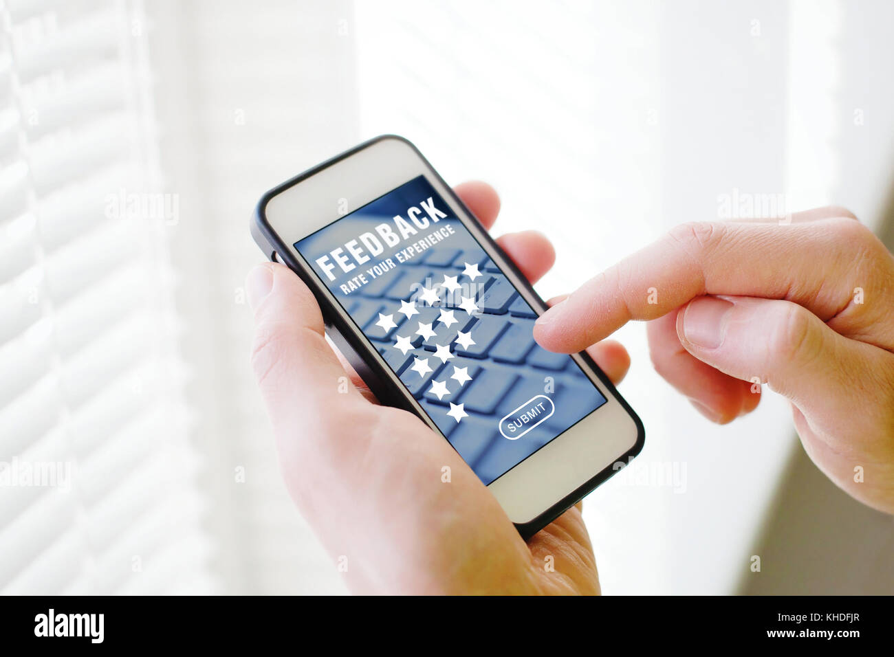 feedback concept, writing review page on the screen of smart phone ...