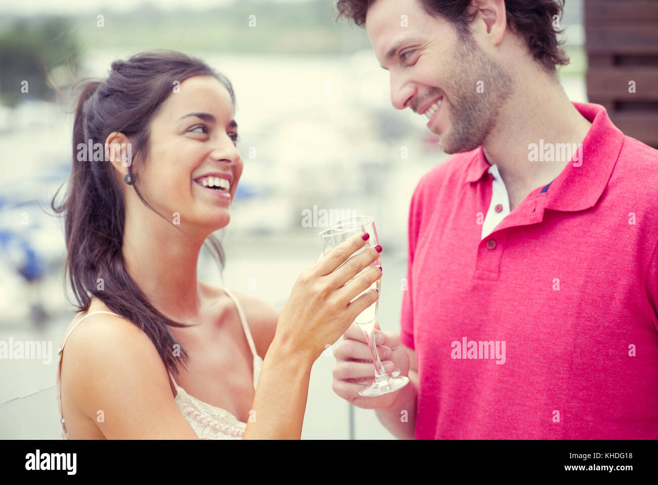 Caucasian couple clinking glasses in hi-res stock photography and ...