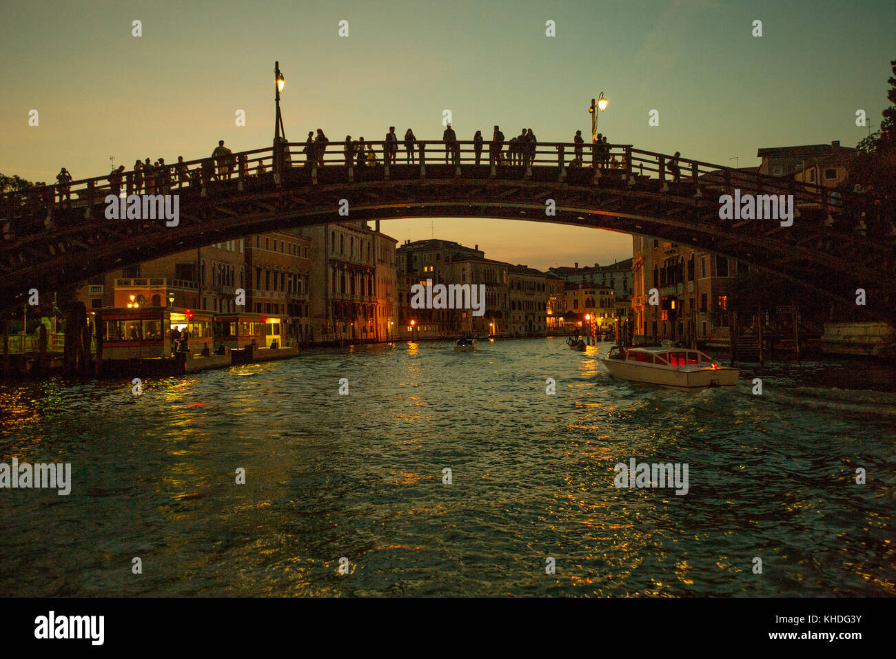 Tourists visit the Accademia Bridge (Ponte dell'Academia) on the Grand ...