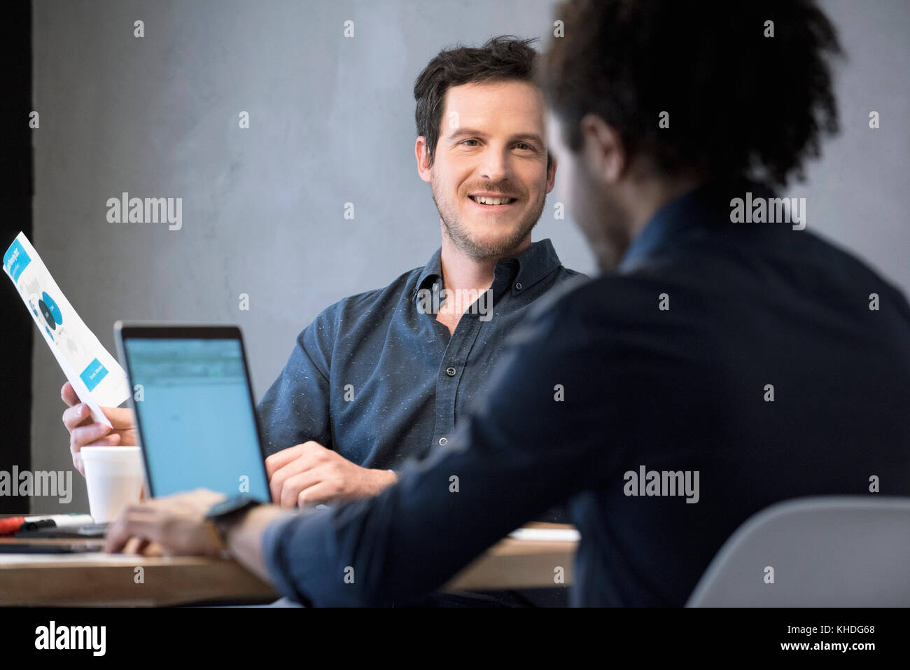 Colleagues collaborating on project Stock Photo - Alamy