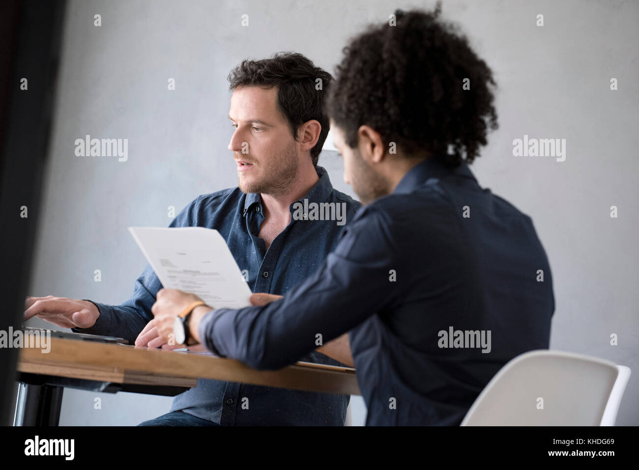 Two business people reviewing documents hi-res stock photography and ...