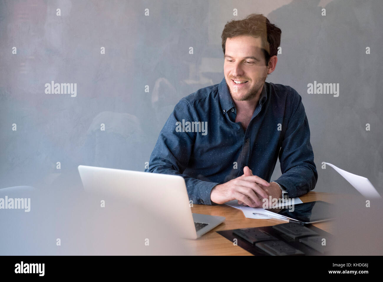 Man in office using laptop computer Stock Photo - Alamy